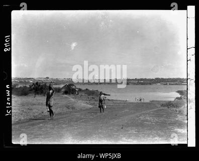 A scene from Kisumu, Kenya Colony, shows native boys bathing across the ...