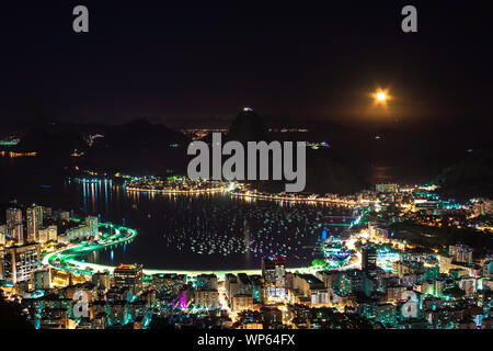 Full moon with Christ the Redeemer in Rio de Janeiro, Brazil - January ...