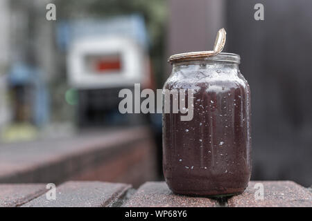 Can of date expired jam in of of Ukrainian streets Stock Photo - Alamy
