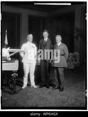 Photograph of Colonel Charles Lindbergh with a group, featuring a model ...
