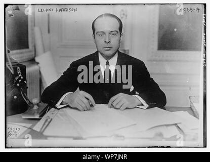 Leland Harrison, a notable figure in history, captured at his desk in a ...