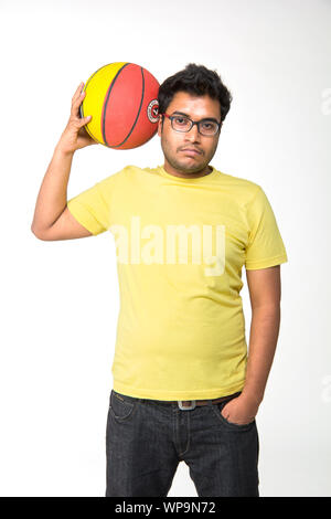 Image of sad young sportsman standing isolated over white background ...