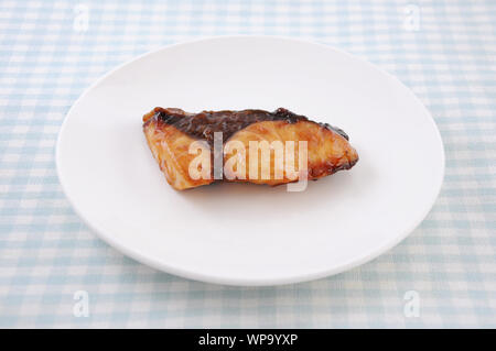 broiled teriyaki fish Japanese amberjack on plate isolated on table ...