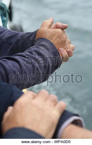 Two hands clasped together in monochrome Stock Photo - Alamy