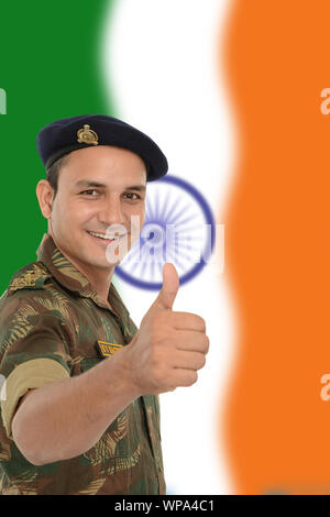 Army soldier showing thumbs up sign and smiling Stock Photo - Alamy