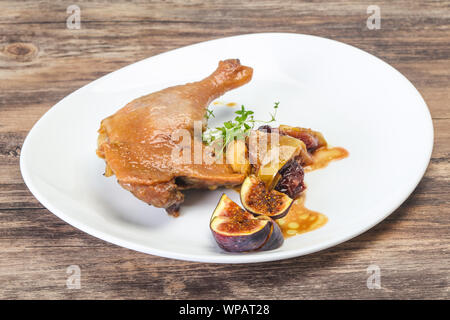 Roasted. duck. leg with plum, fig and apple Stock Photo - Alamy