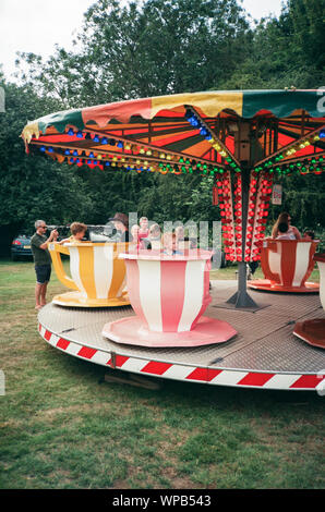 Teacup fairground ride at Medstead Fete, Medstead, Hampshire, England ...