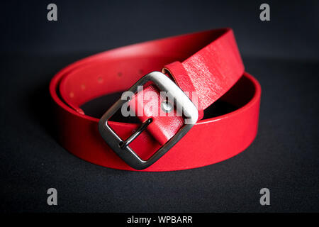 detail of women's red belt isolated over black background Stock Photo ...