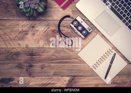 Vintage old camera and notebook on white wooden table background. Top ...
