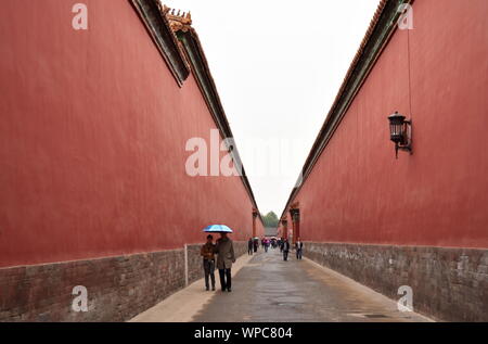 Red walls of the Forbidden City in Beijing, China and ancient drainage ...