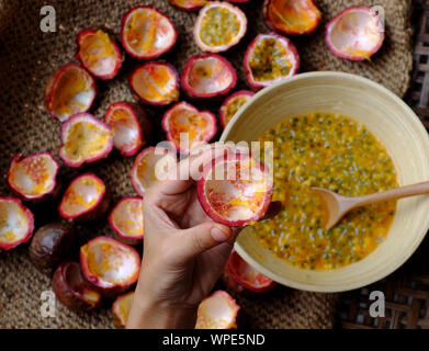 Passiflora edulis (Passion fruit) cross section showing seeds inside ...