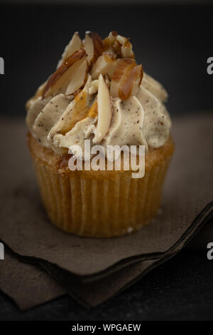 Tasty mini cupcakes on a vintage background, sweet dessert for ...