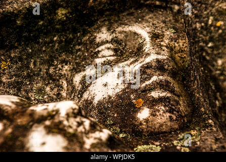 Human face carved on rock Stock Photo - Alamy
