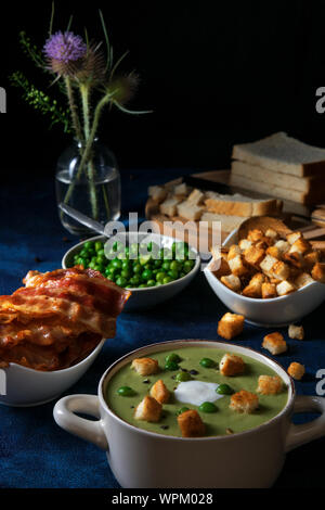 Cream with flowers thistle on wooden background. Medicinal plant ...