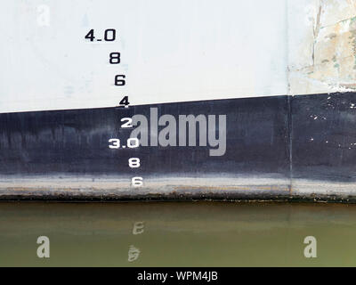 The waterline numbers and markings on the hull of a cargo ship Stock ...