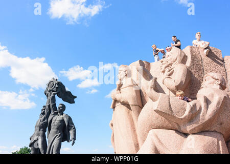 An old soviet bronze statue depicting Russian and Ukrainian nations ...