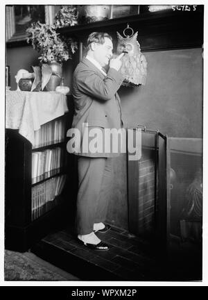 Man near owl ornament Stock Photo - Alamy