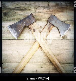 Wood wall with an axe hanging Stock Photo - Alamy