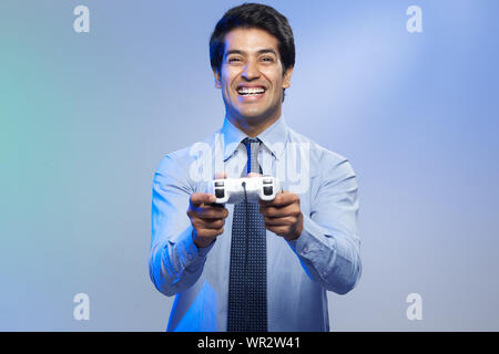 Businessman playing video game Stock Photo - Alamy