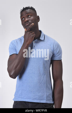 african man having a doubt or question on white background Stock Photo ...
