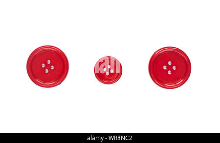Three Various red sewing buttons isolated on background Stock Photo - Alamy