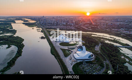 An aerial view at sunset of Harbin Opera House or Harbin Grand Theater ...