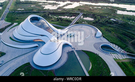 An aerial view at sunset of Harbin Opera House or Harbin Grand Theater ...