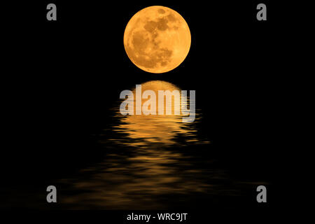 Super moon yellow and shadows in the water and bokeh Stock Photo - Alamy