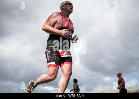 A man running in a race, Dublin city, Ireland Stock Photo - Alamy