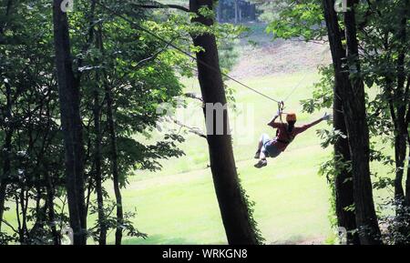A girl has fun zip lining in Guatemala Stock Photo - Alamy