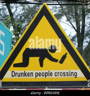 Drunken people crossing warning sign showing a drunk man crawling in ...