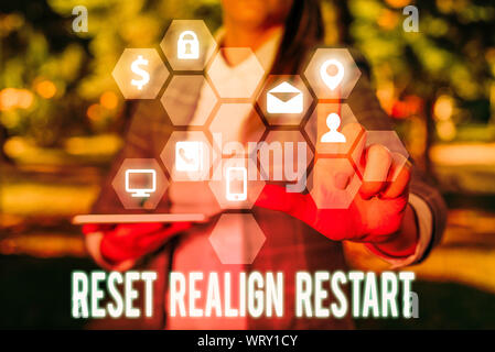 Writing note showing Reset Realign Restart. Business concept for Life ...