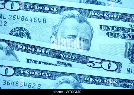 USD fifty dollar bills close up. Money background blue color toned ...
