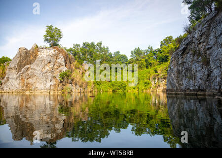 Lake and roks in Danzhou Stone Flower Caves, Geopark next to Haikou ...