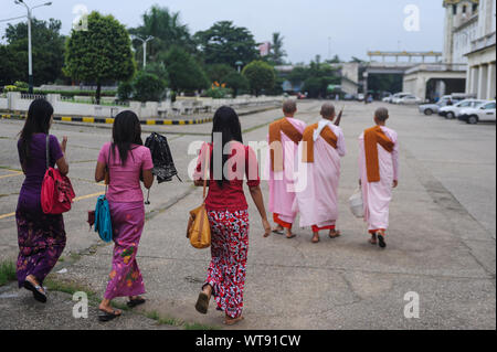 Buddhist nuns and pedestrians walk on a road Sunday, Feb. 1, 2026, in ...