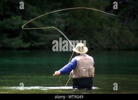one man casting a rod Stock Photo: 19311405 - Alamy