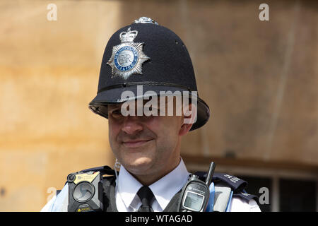 The helmet of a British police officer "Bobby". Helmet of historical ...