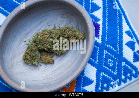 Marijuana in Clay Bowl on Blue Textile in Mexico Stock Photo - Alamy