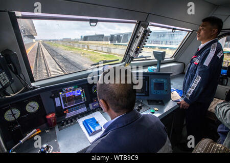 Nairobi. 10th Sep, 2019. A test train heads back under a staff member's ...
