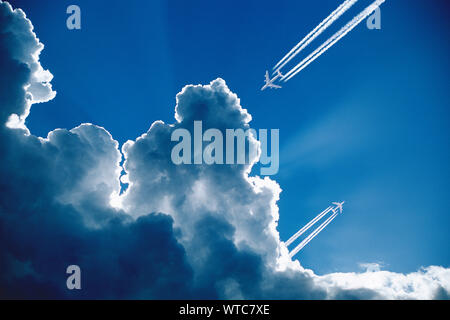 Two airplanes fly in opposite directions in the sky over Schwerin ...