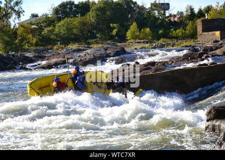People in a yellow raft white water rafting at Penrith White Water ...