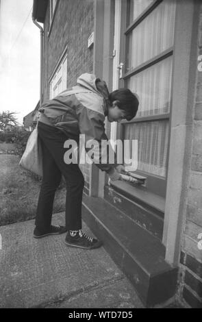 Boy delivering newspaper Stock Photo: 2470073 - Alamy