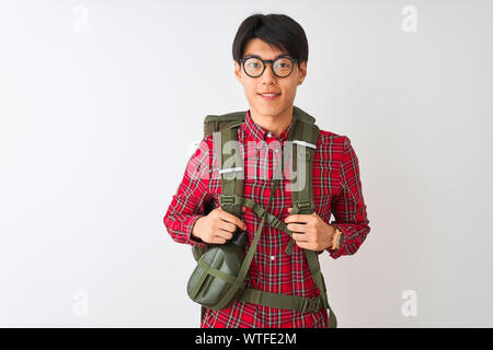 Chinese hiker man wearing backpack canteen glasses over isolated white ...