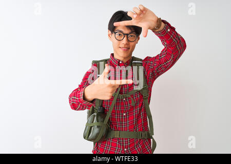 Chinese hiker man wearing backpack canteen glasses over isolated white ...