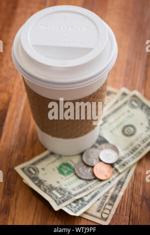 Coffee to go with cash money Stock Photo - Alamy