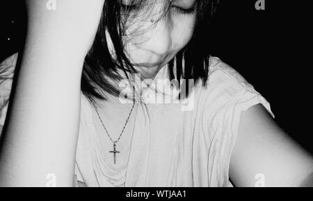 Woman wearing cross necklace Stock Photo: 18587032 - Alamy