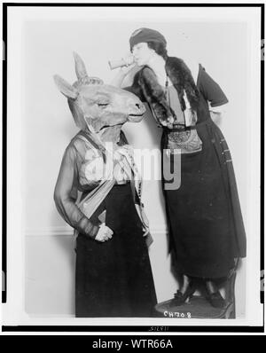 Mrs.Guilford Dudley of Nashville with ear trumpet, talking into ear of ...