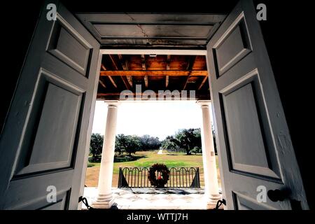 View through open front door entrance to garden beyond Stock Photo - Alamy