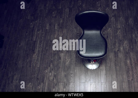 Vacant black bar chair top view on wooden surface with empty space ...