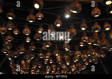 Dark background with colorful lamp lights and Christmas decorations - a ...